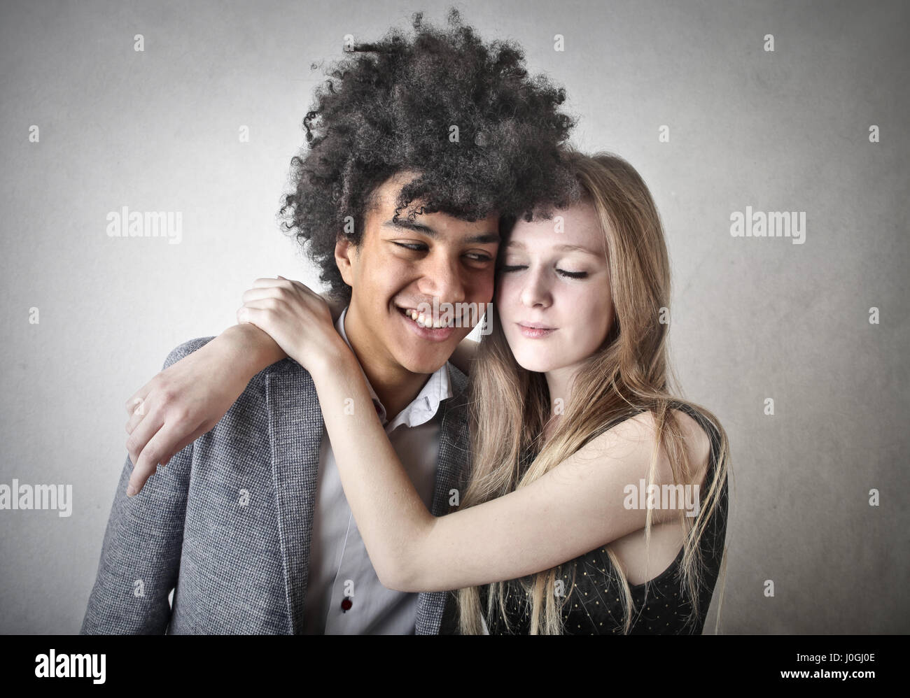 Woman hugging teen boy hi-res stock photography and images - Alamy