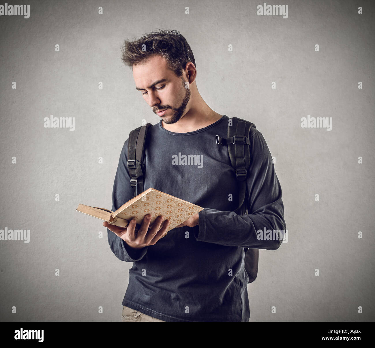 Man reading a book Stock Photo - Alamy