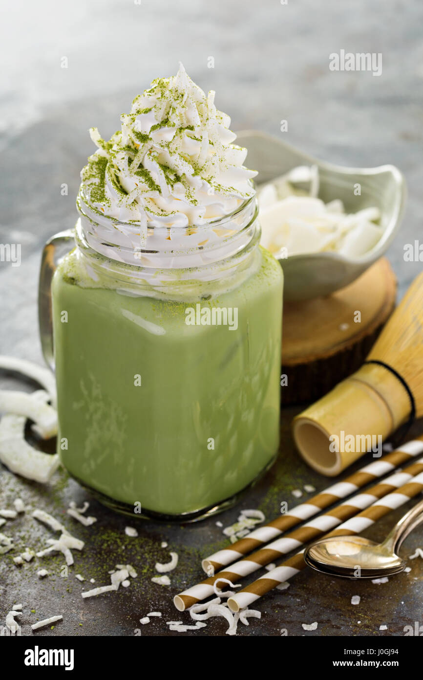 Iced matcha latte with coconut cream Stock Photo - Alamy