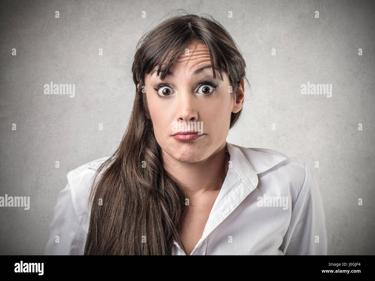 Woman feeling doubtful Stock Photo - Alamy