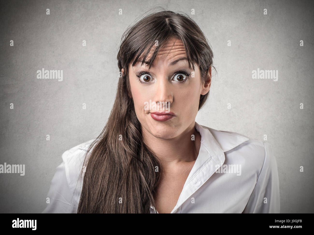 Woman feeling doubtful Stock Photo - Alamy