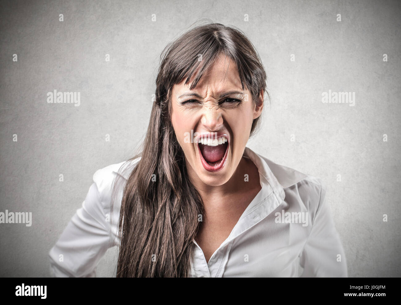 Closeup angry young woman face hi-res stock photography and images - Alamy
