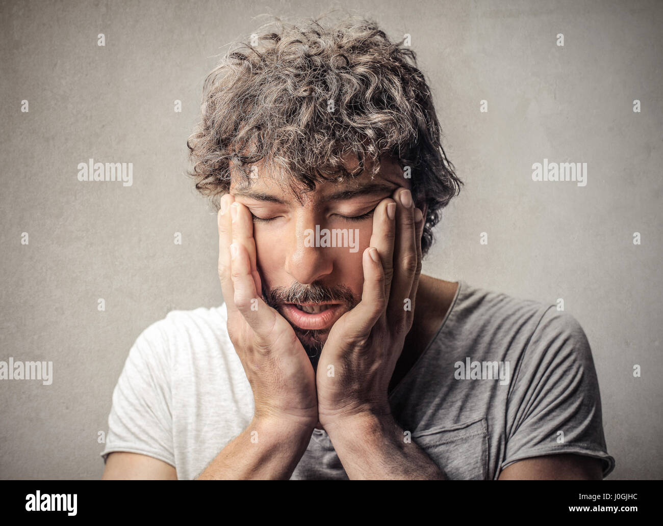 Man feeling tired Stock Photo - Alamy