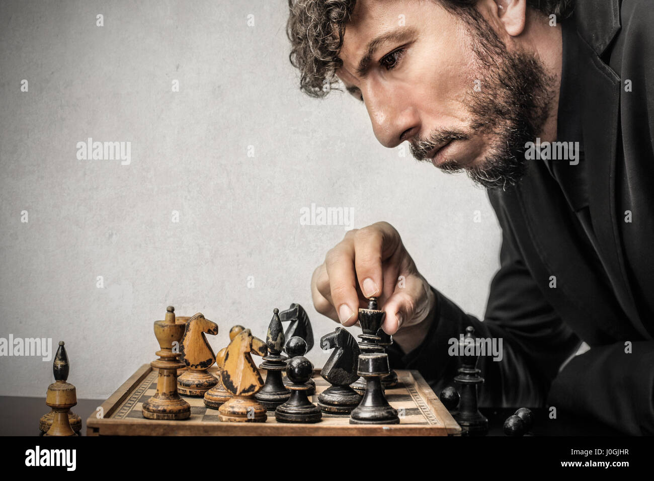 Man playing chess Stock Photo - Alamy