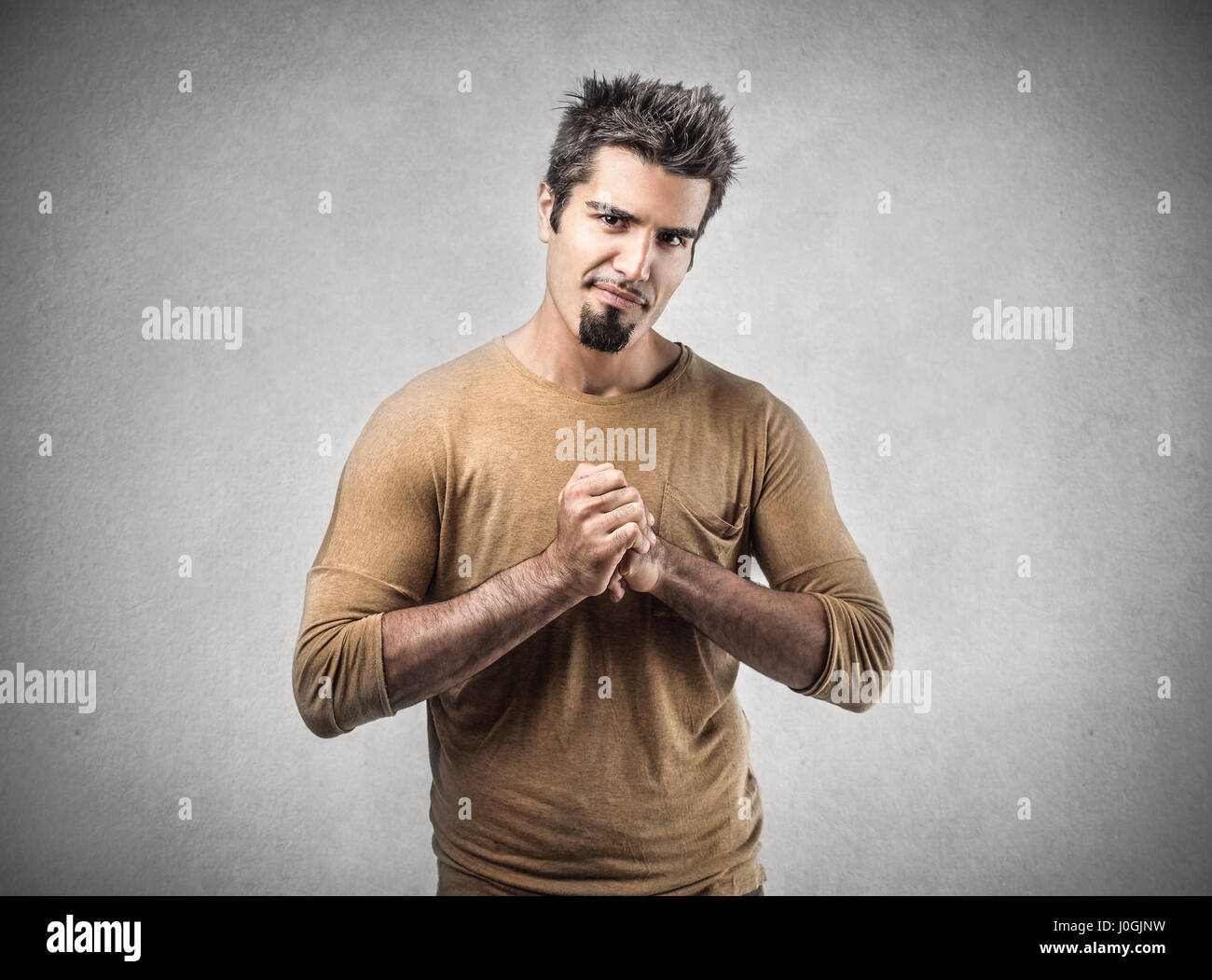 Man looking into camera Stock Photo - Alamy