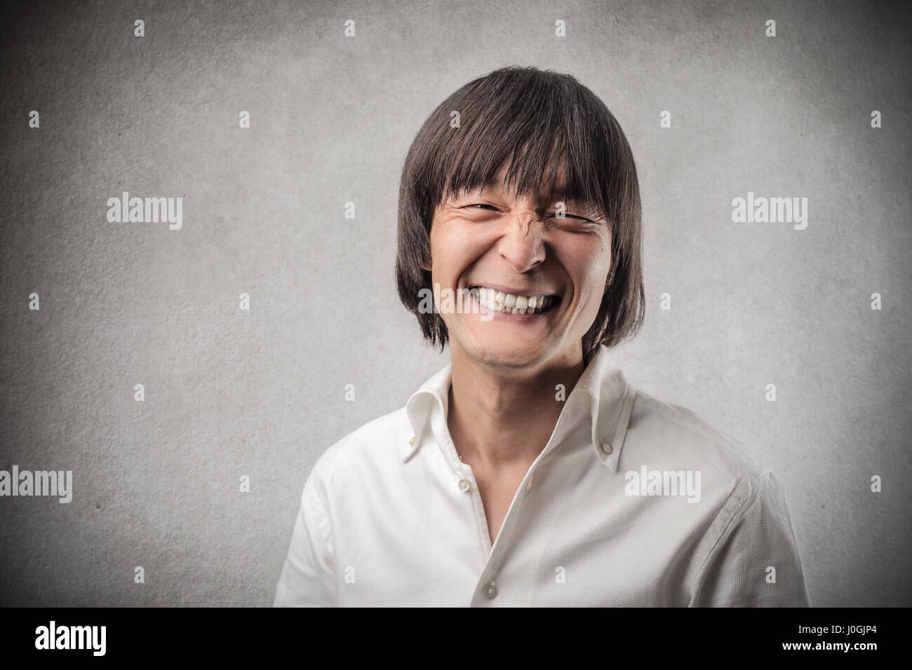 Asian man smiling Stock Photo - Alamy