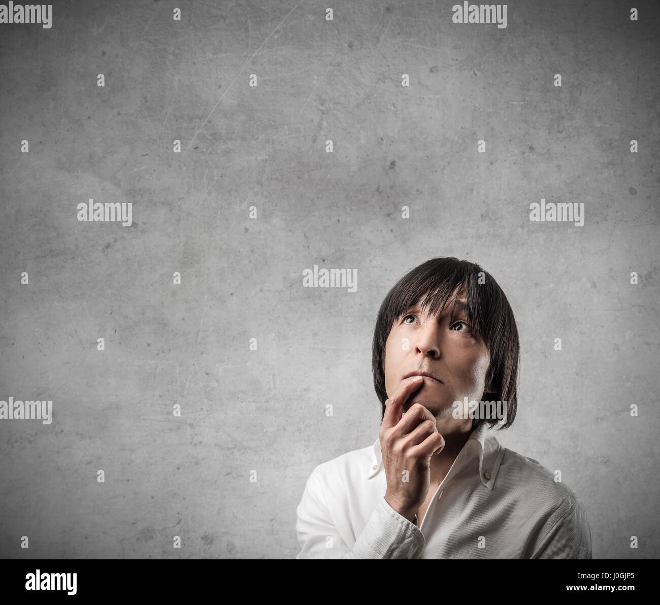 Boy thinking face expression hi-res stock photography and images - Alamy