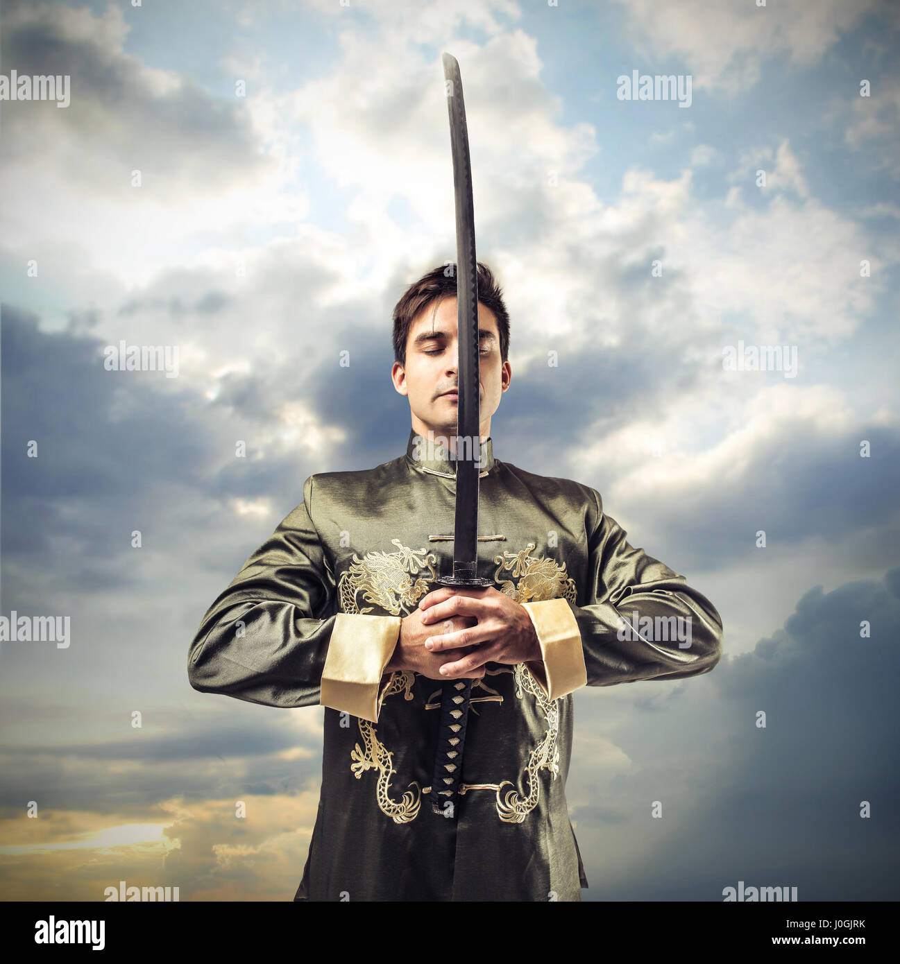 Man with sword Stock Photo - Alamy