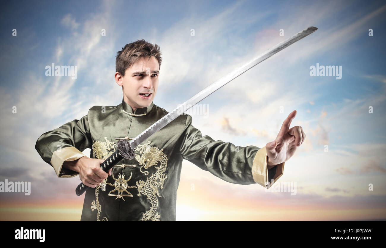 Man fighting with sword Stock Photo - Alamy