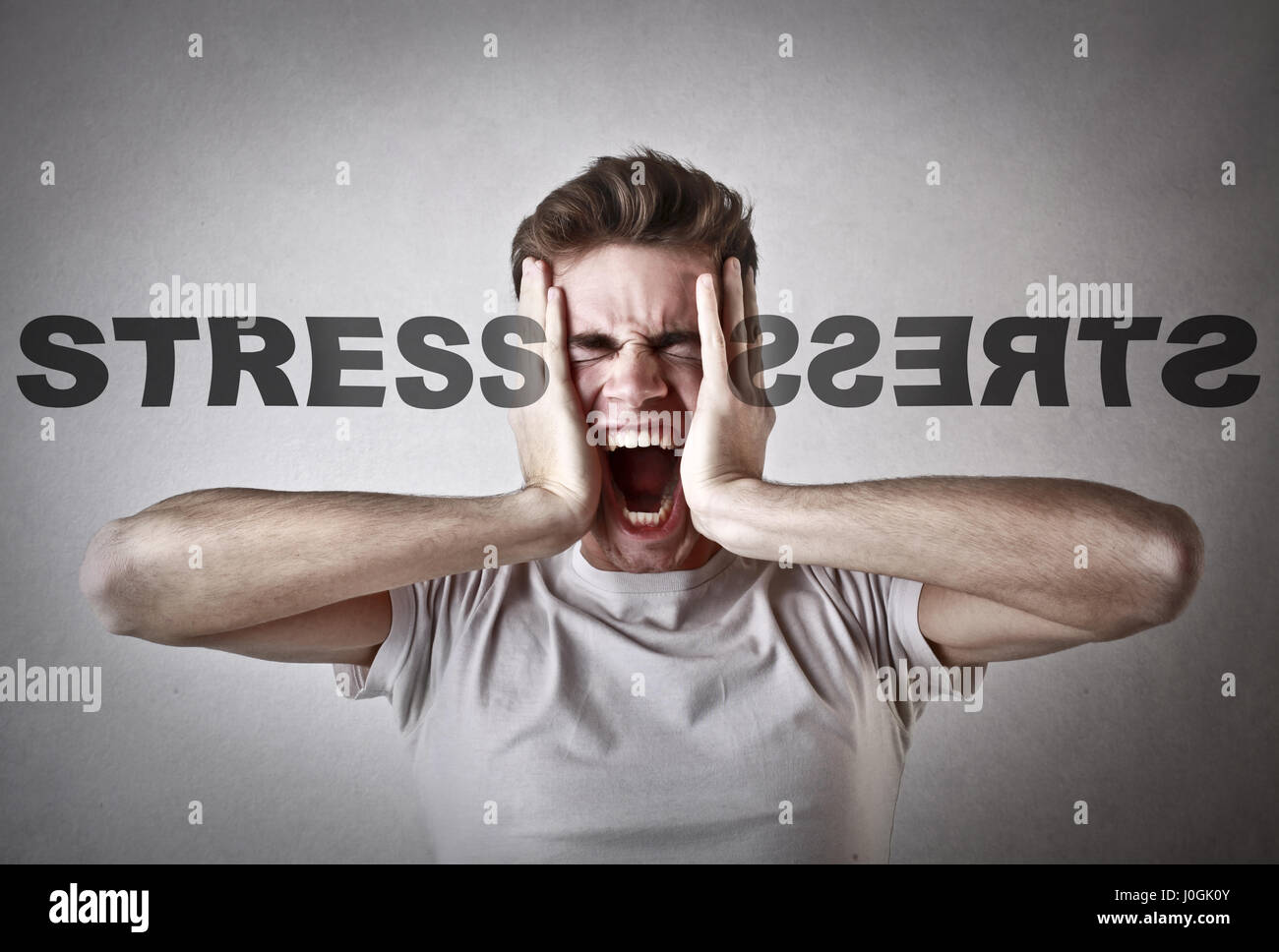 Young man feeling stressed Stock Photo - Alamy