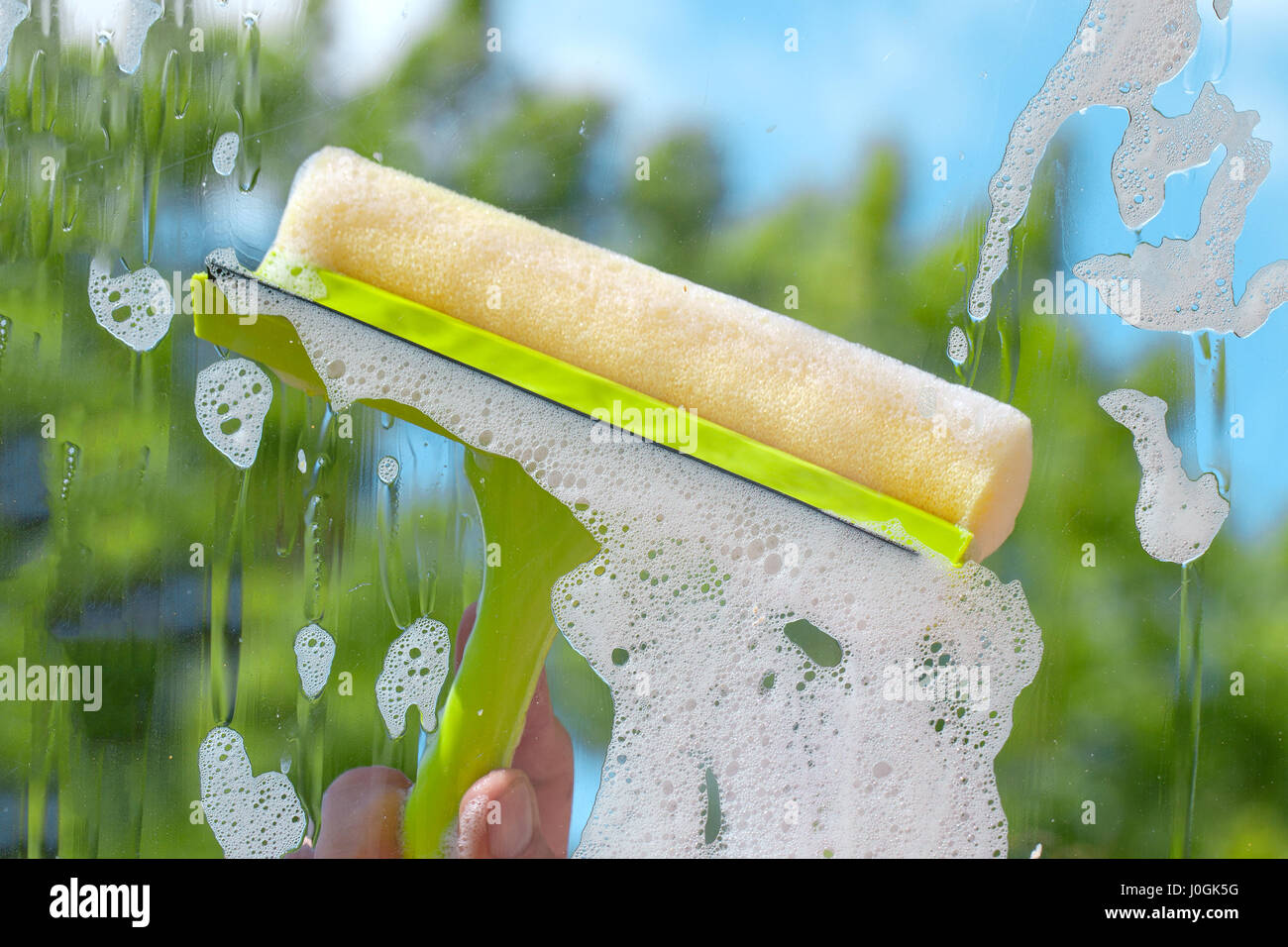 Human hand washing window in nice summer day Stock Photo - Alamy