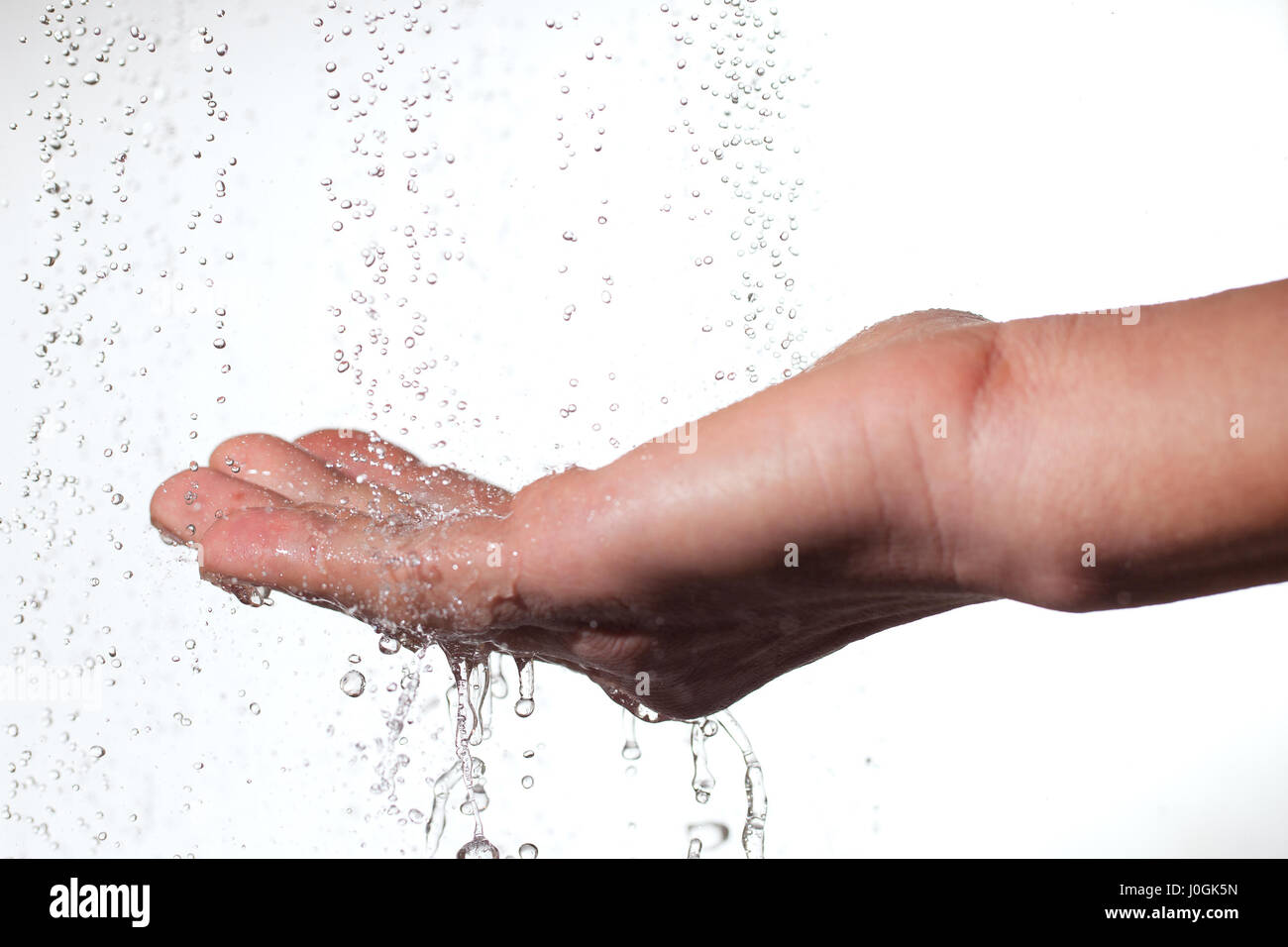 Water splash and human hand Stock Photo - Alamy