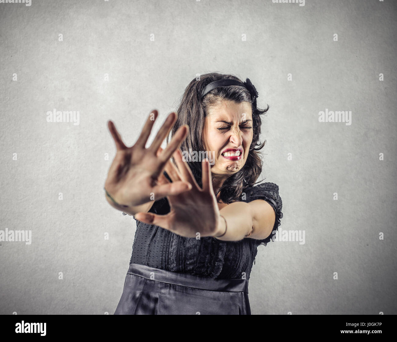 Brunette woman stopping you Stock Photo - Alamy