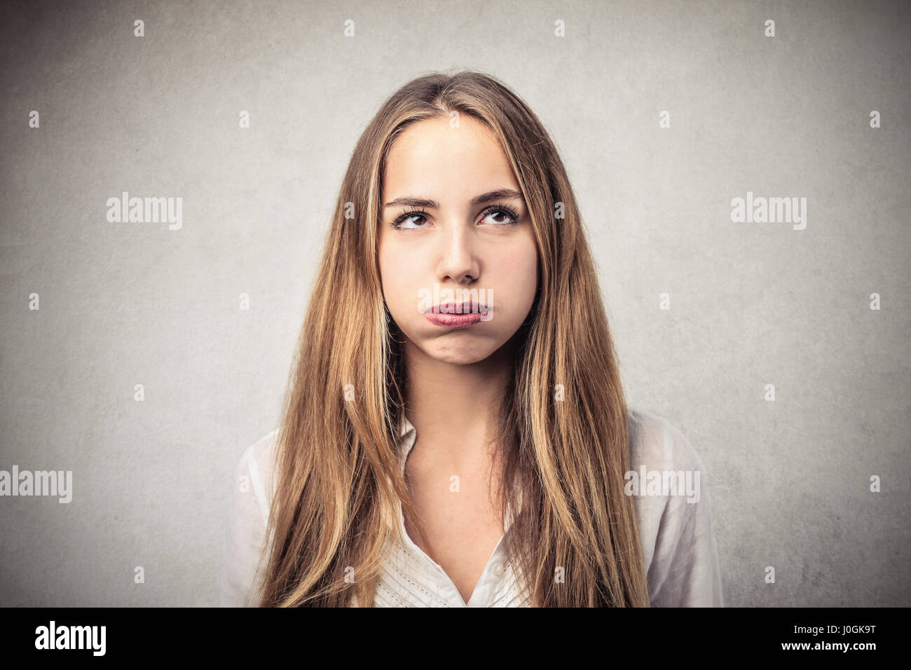Blond woman being stressed Stock Photo - Alamy