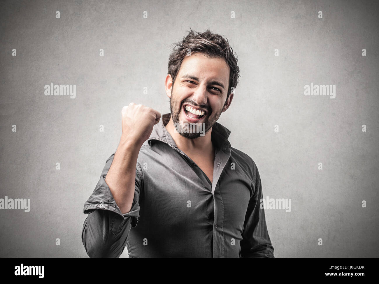 Bearded man feeling victorious Stock Photo - Alamy