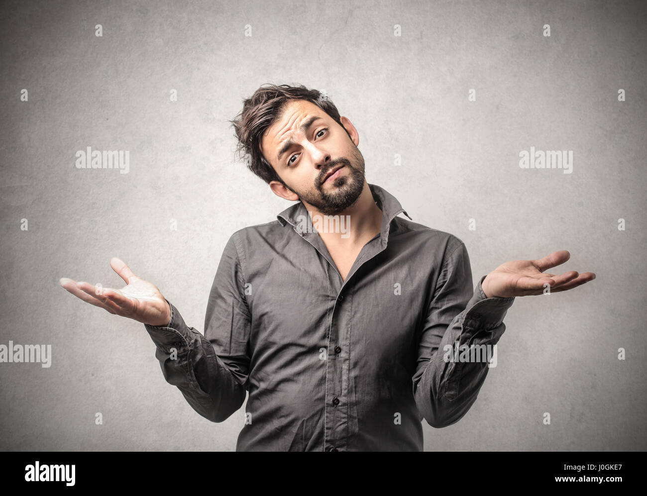Bearded man being puzzled Stock Photo - Alamy