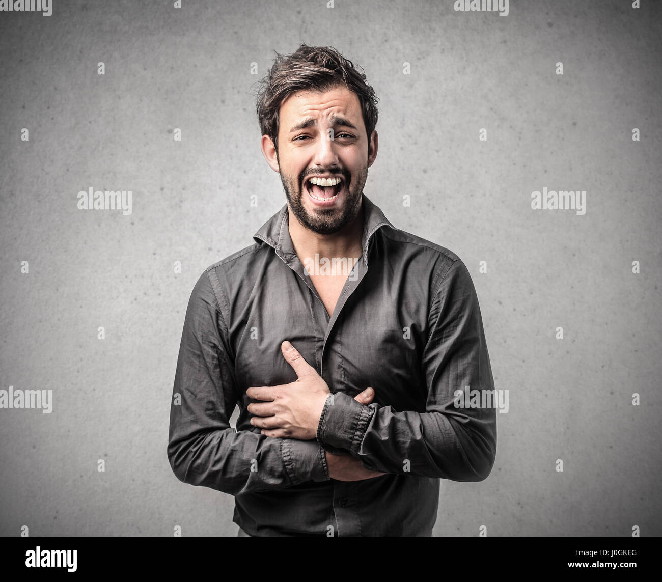 Bearded man laughing at you Stock Photo - Alamy