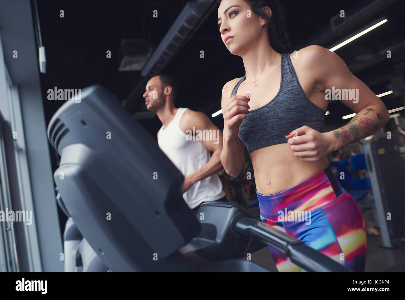 Low angle view of running young athletes Stock Photo - Alamy