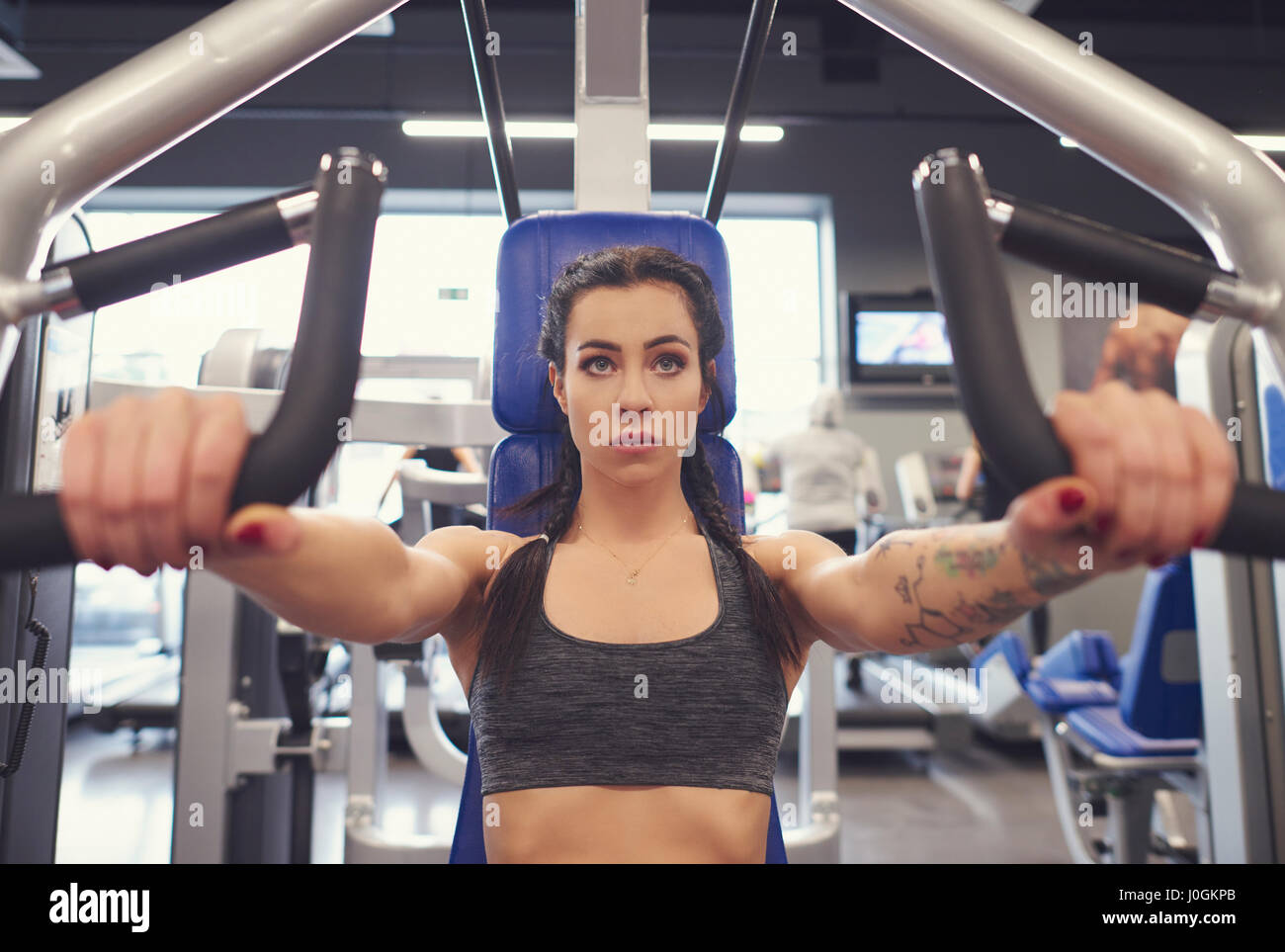 Focus woman doing stretching session gym Stock Photo - Alamy