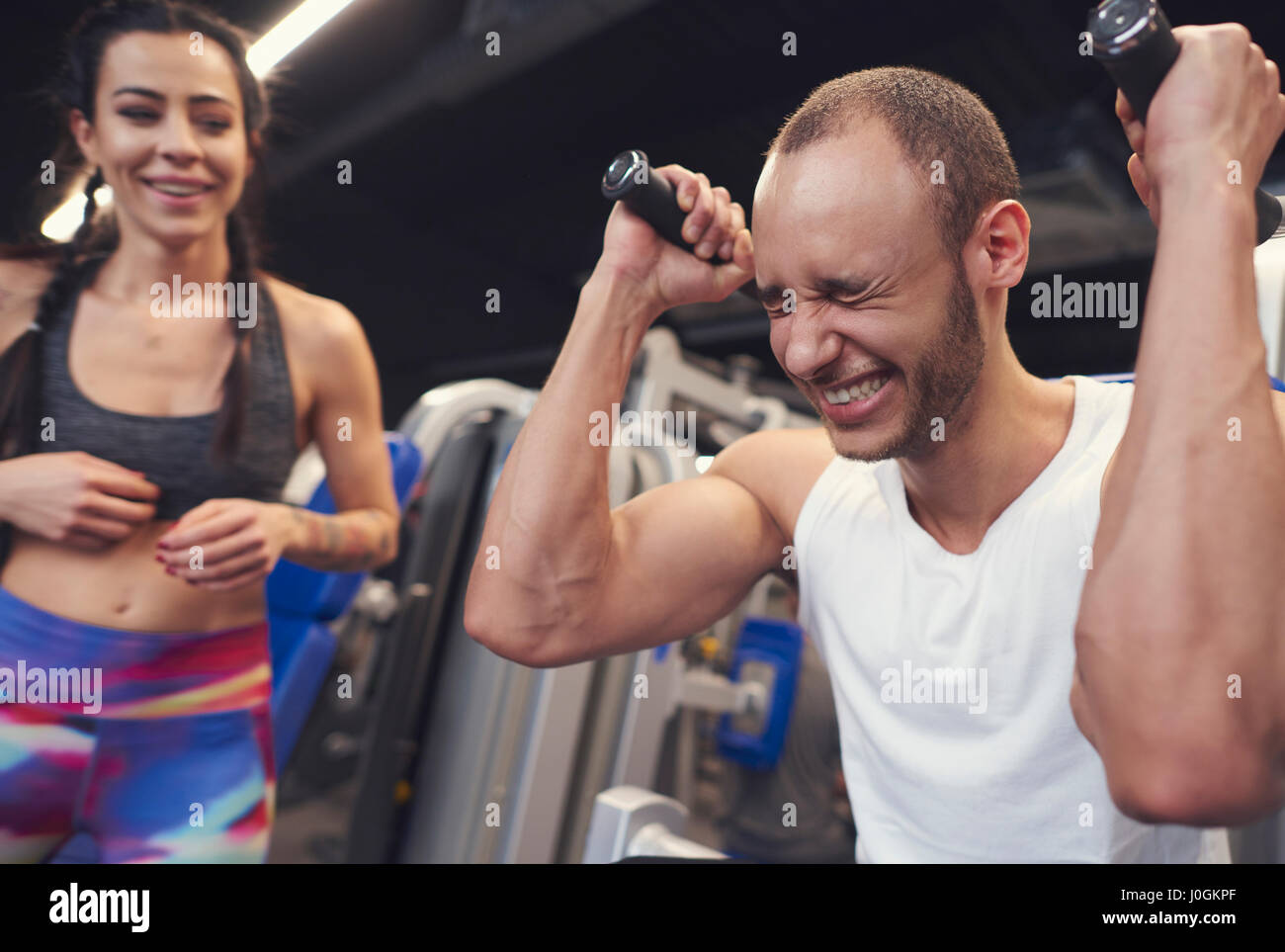 Exercise challenges between fit couple Stock Photo - Alamy