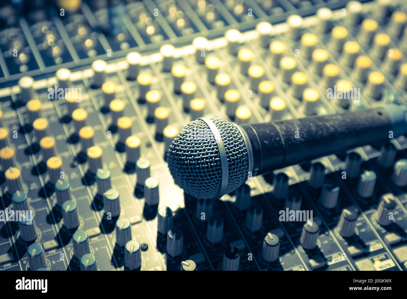 microphone and soundboard under stage lighting Stock Photo - Alamy