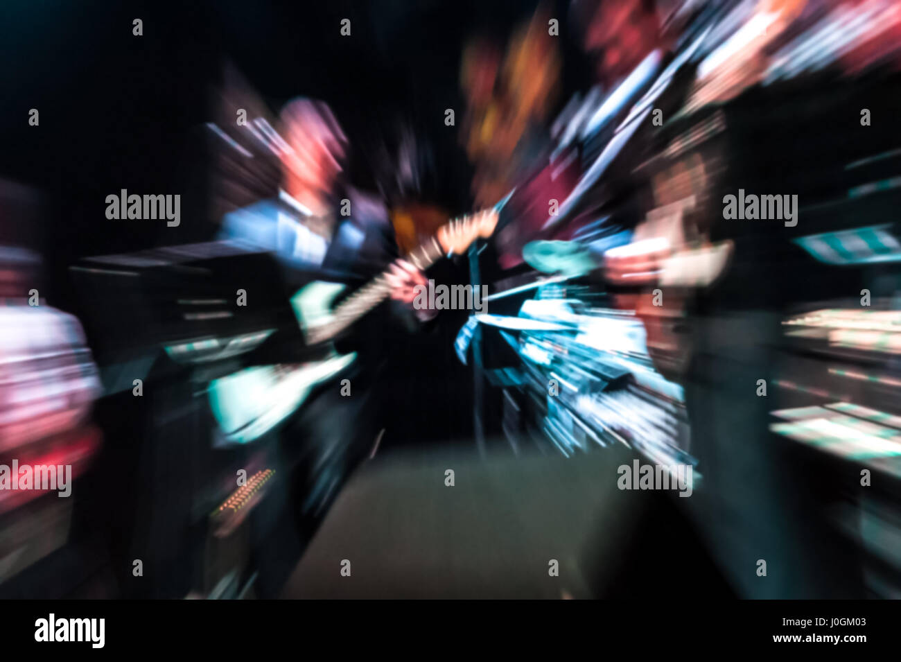 blurred motion of rock musicians on stage Stock Photo - Alamy