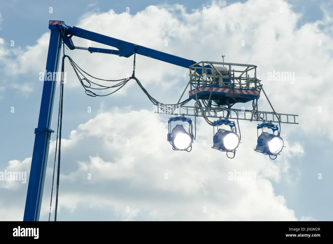 high powered spotlights illuminating an outdoor movie set Stock Photo ...