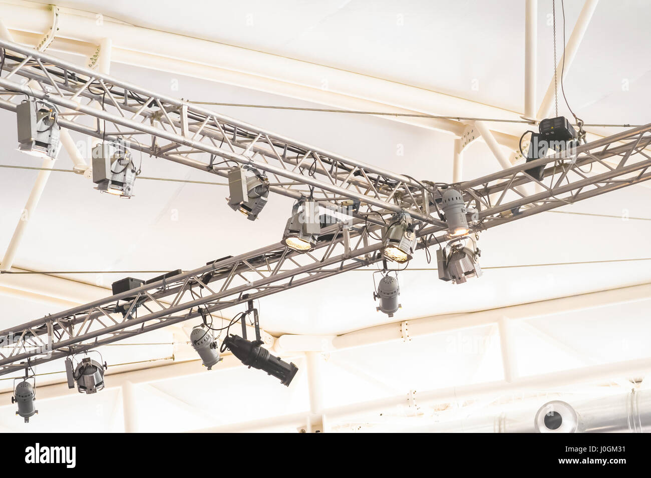 rig lighting projecting bright lights inside a large marquee venue ...