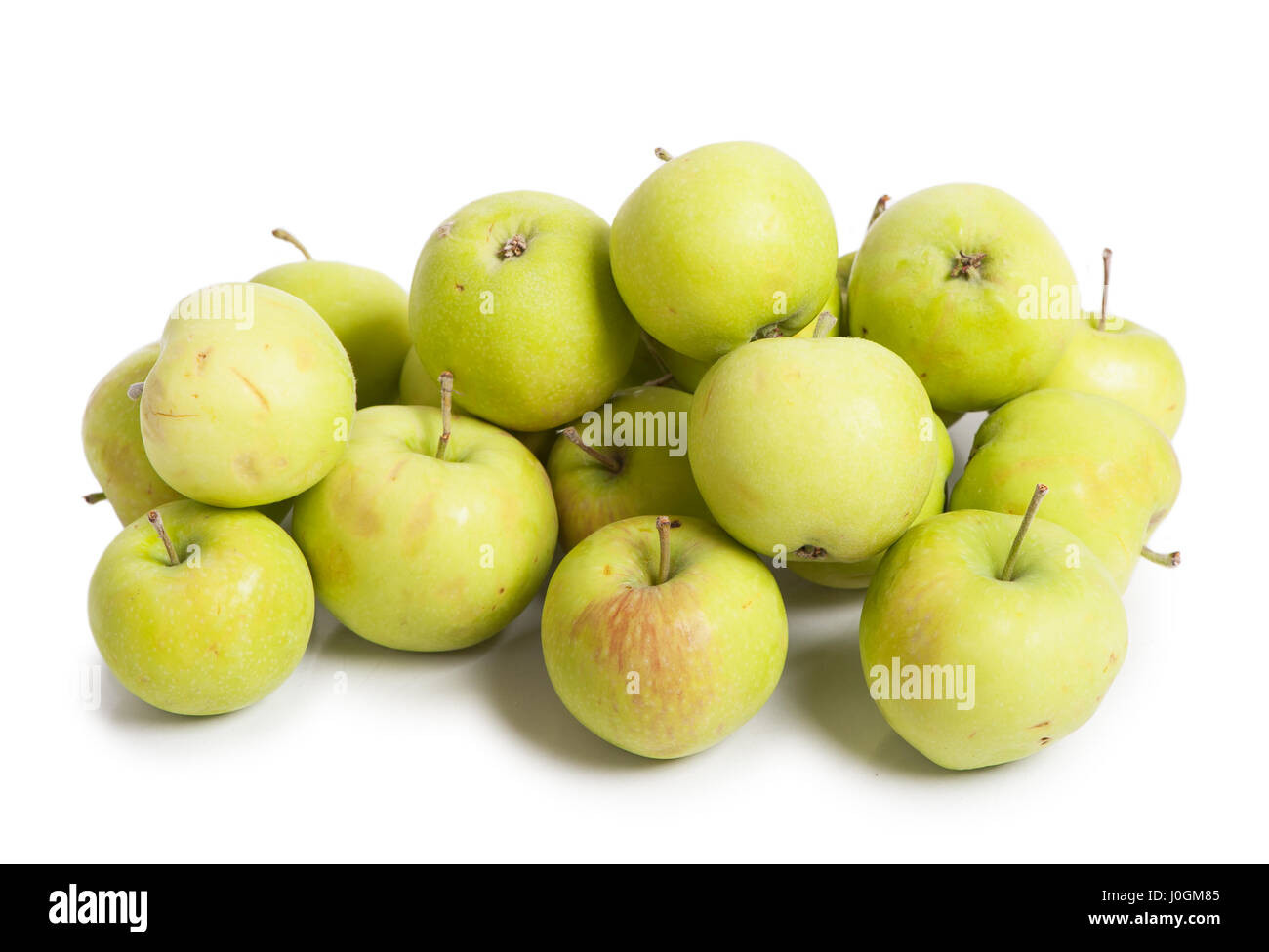 Many green apples isolated on white background Stock Photo - Alamy