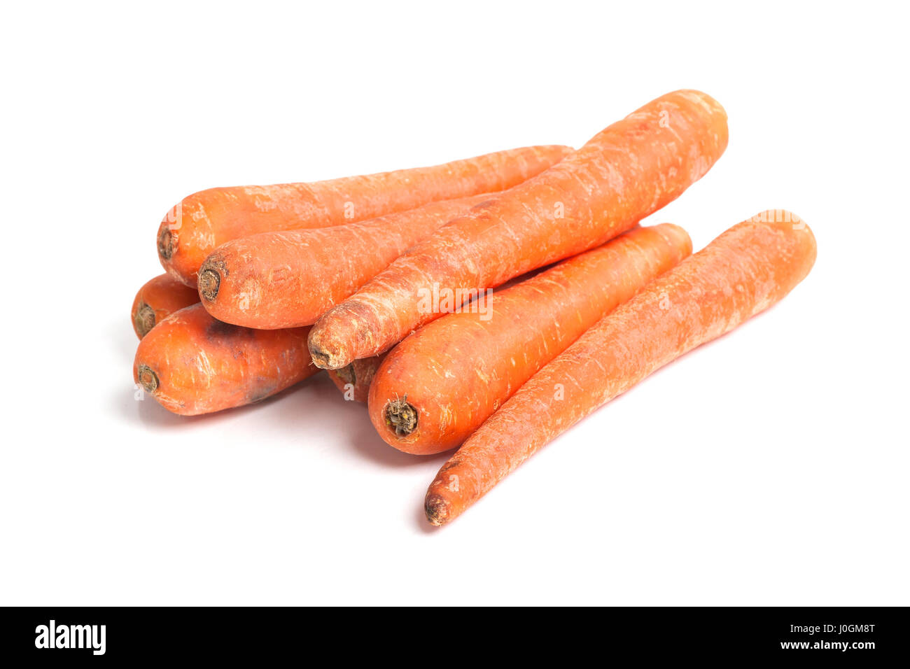 Many carrots isolated on white background Stock Photo - Alamy