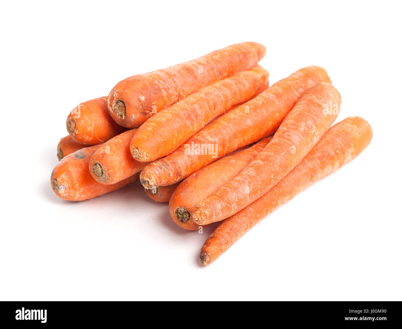 Many carrots isolated on white background Stock Photo - Alamy
