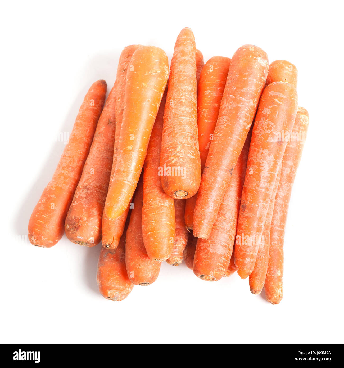 Many carrots isolated on white background Stock Photo - Alamy