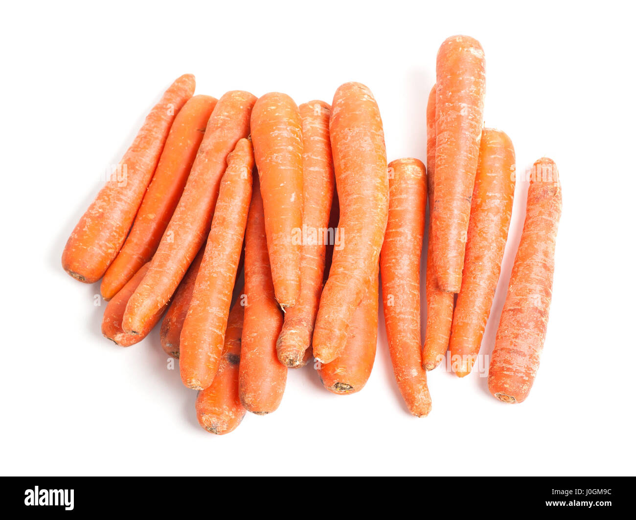 Many carrots isolated on white background Stock Photo - Alamy