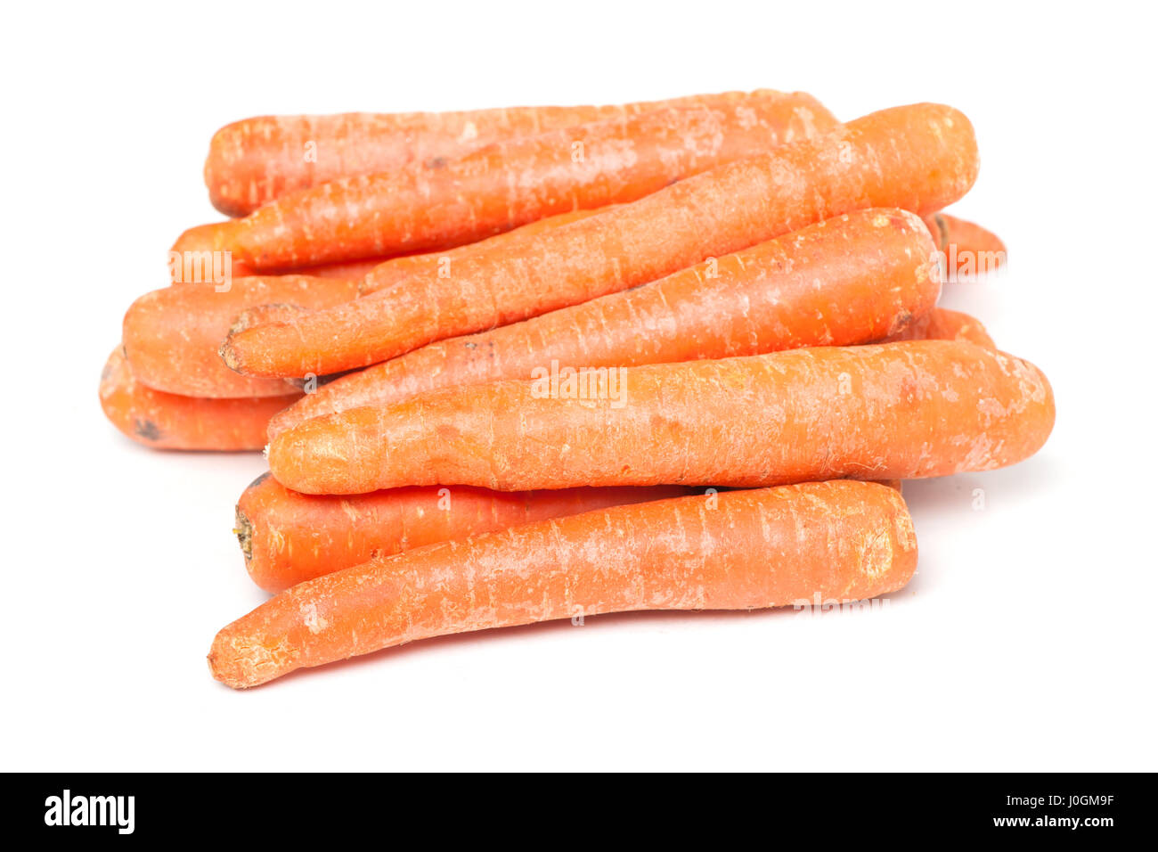 Many carrots isolated on white background Stock Photo - Alamy