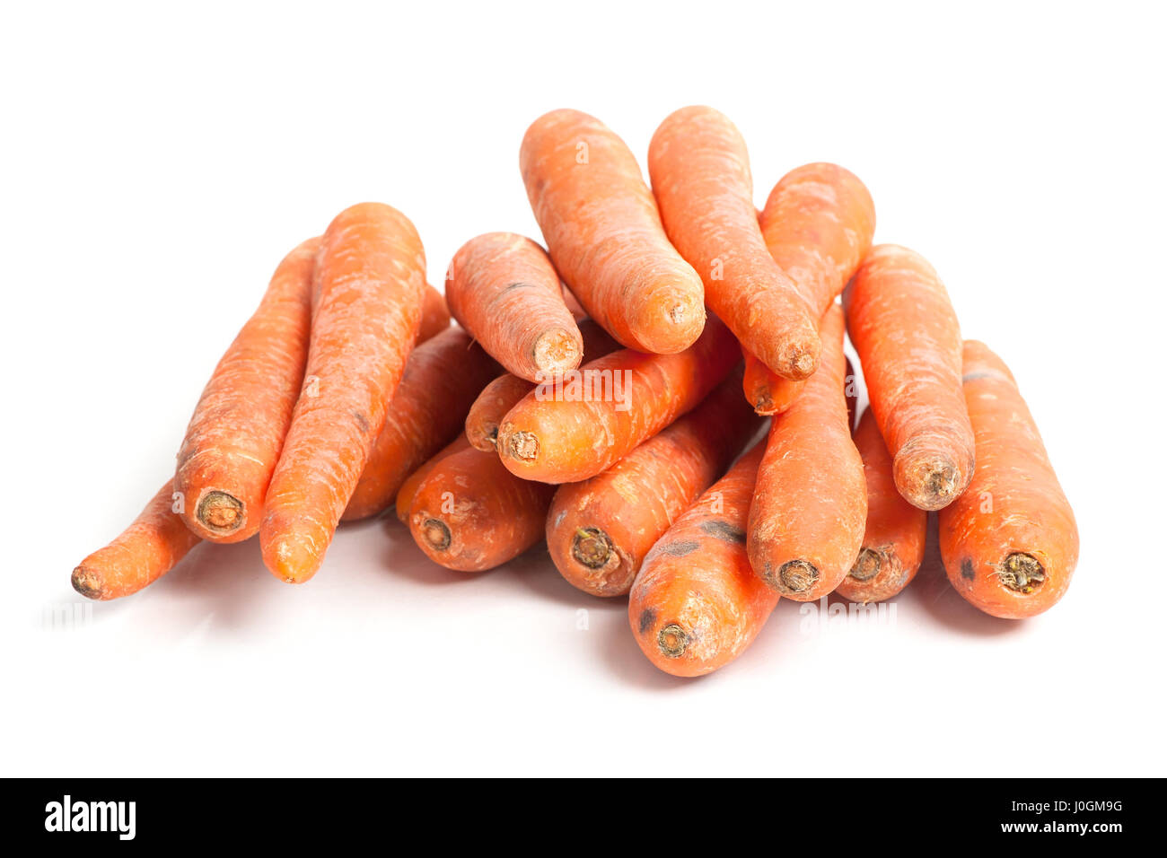 Many carrots isolated on white background Stock Photo - Alamy