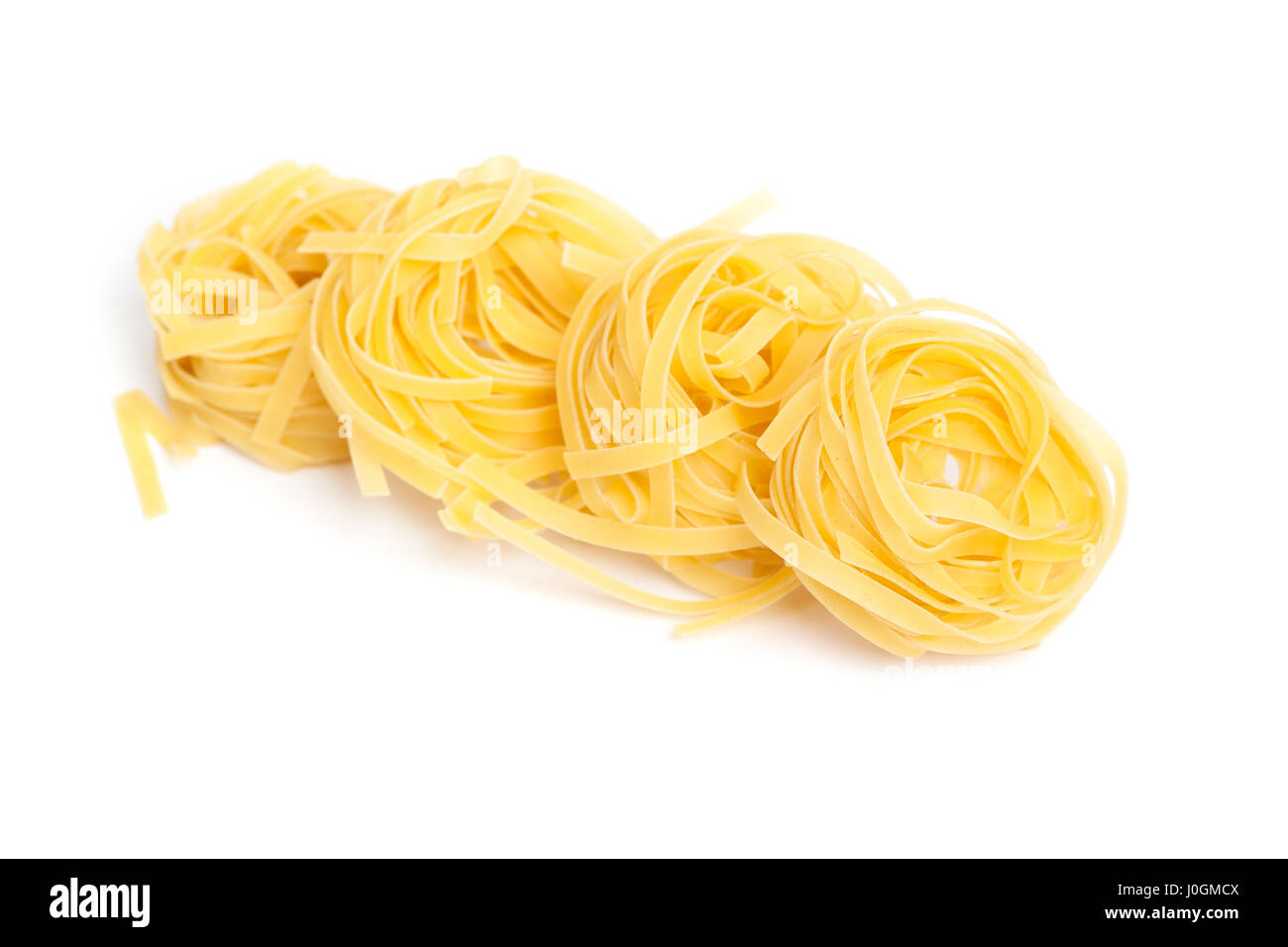 Fettuccine nests pasta Cut Out Stock Images & Pictures - Alamy