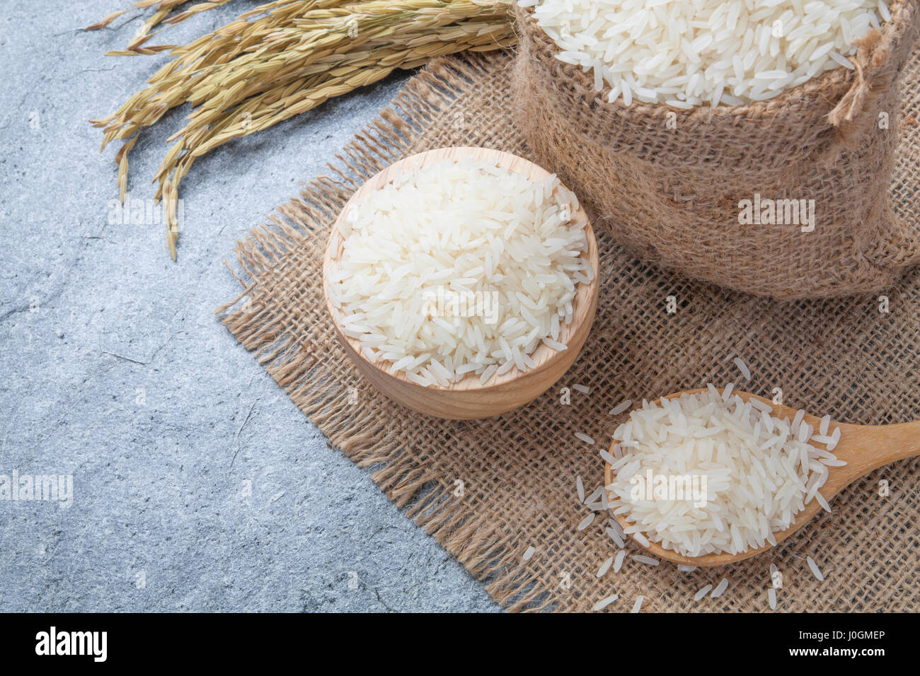 thai fragrant jasmine rice in a bowl with gold spike on Sack Stock ...