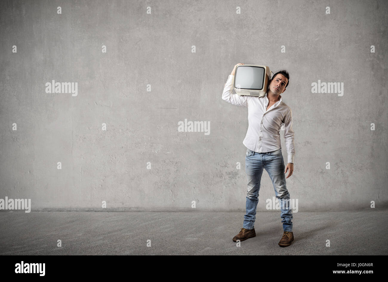 Man holding old tv Stock Photo - Alamy