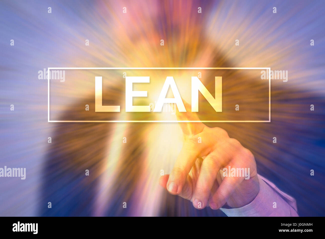 a Business man in a suit touching word "Lean" with colorful god rays ...