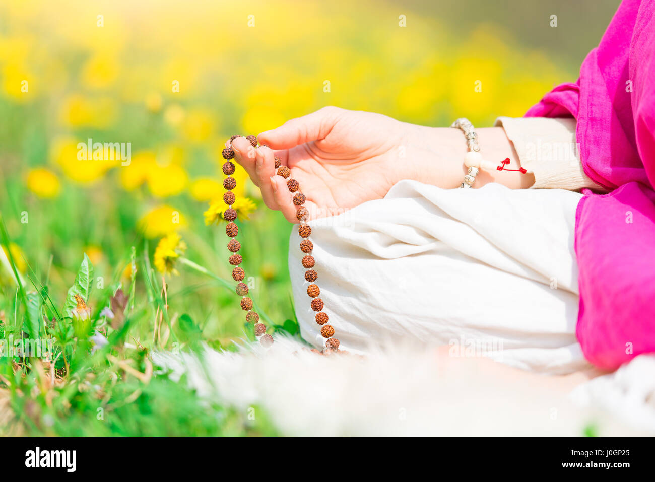 Hand and japa mala prayer beads hi-res stock photography and images - Alamy