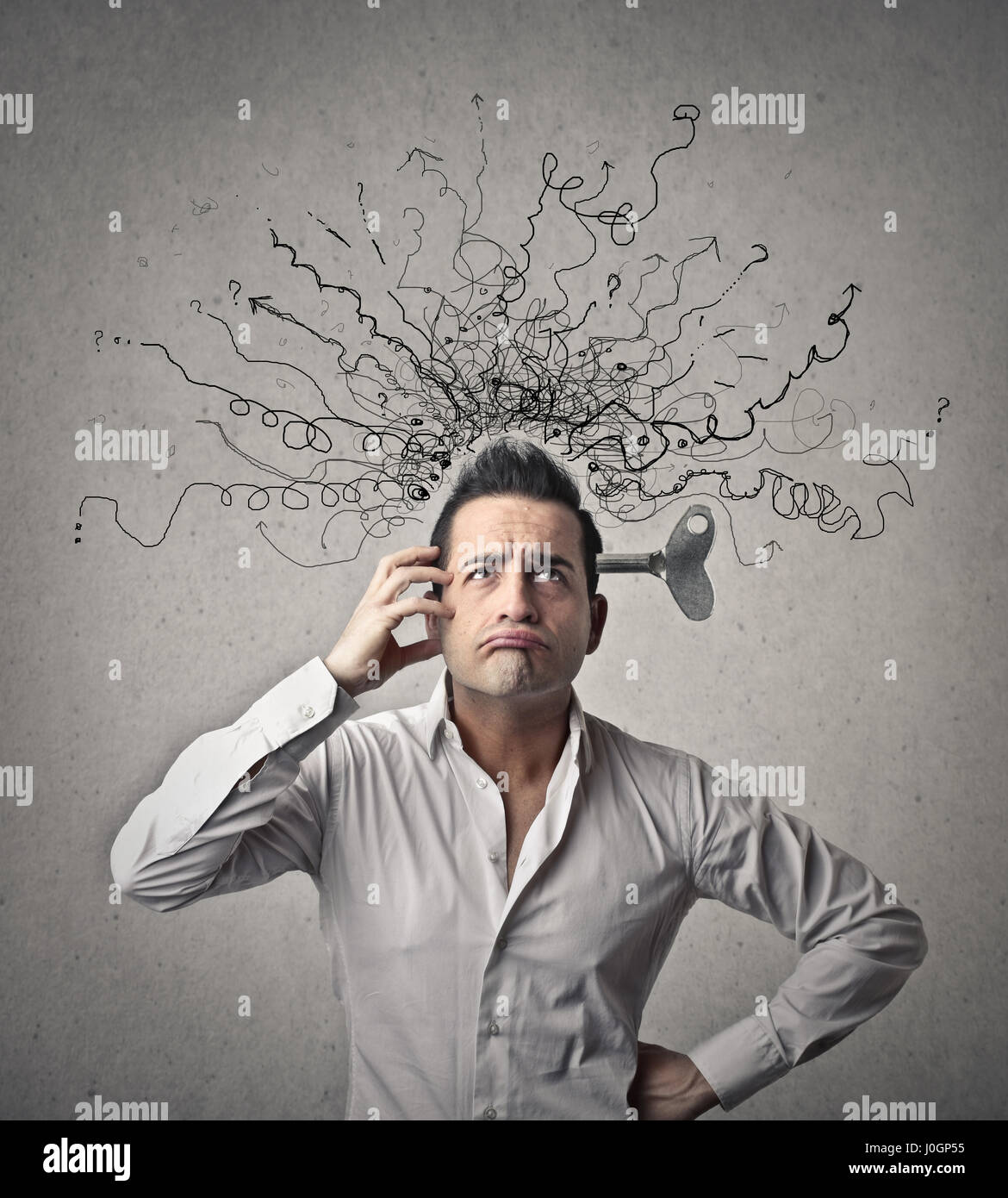 Businessman with a mess in his head Stock Photo - Alamy