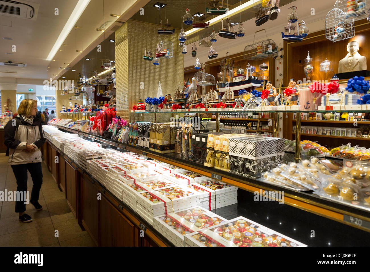 Marzipan sweets and candy on display and shopper inside J.G ...