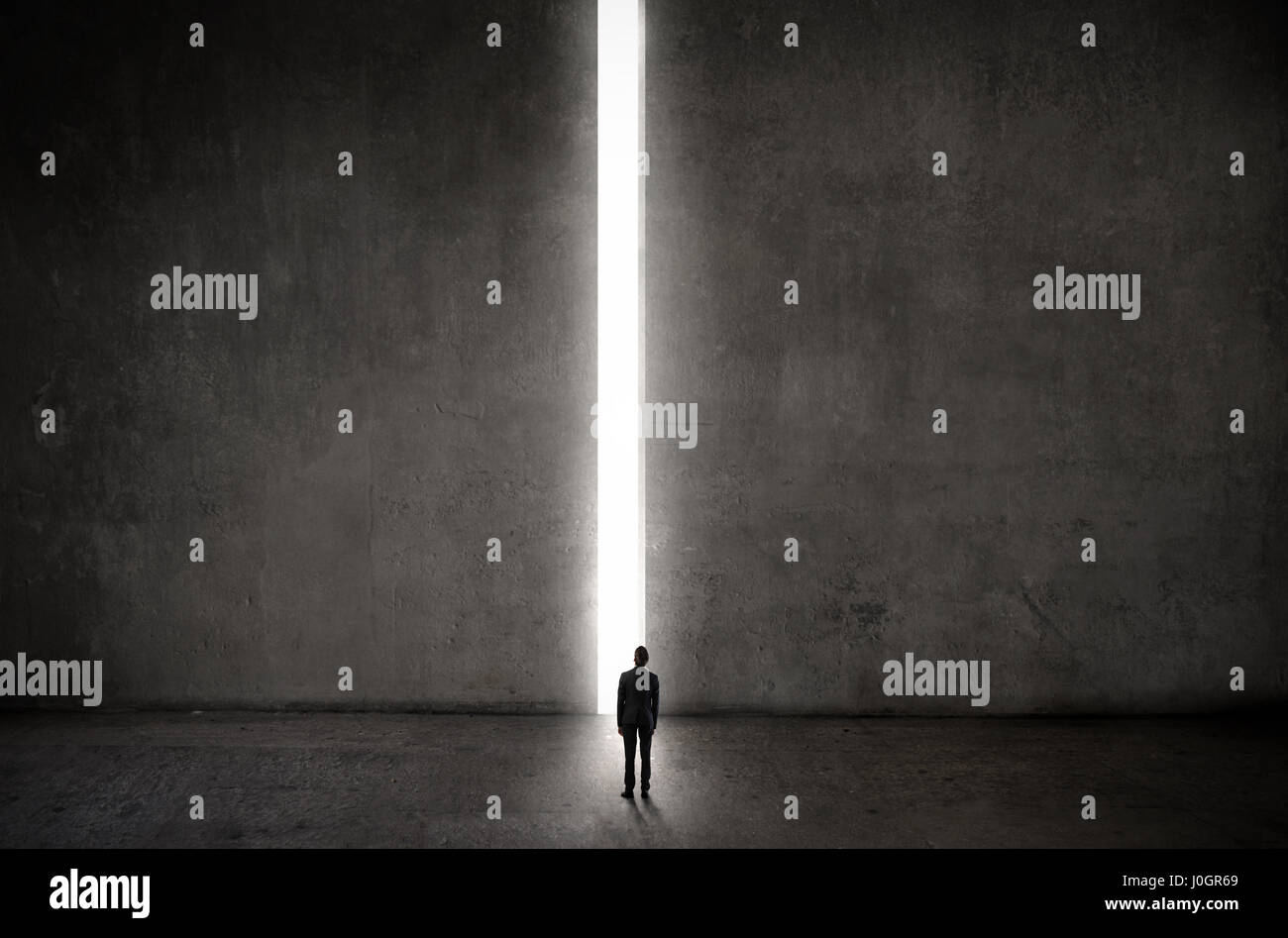 Man standing in front of huge gate Stock Photo - Alamy