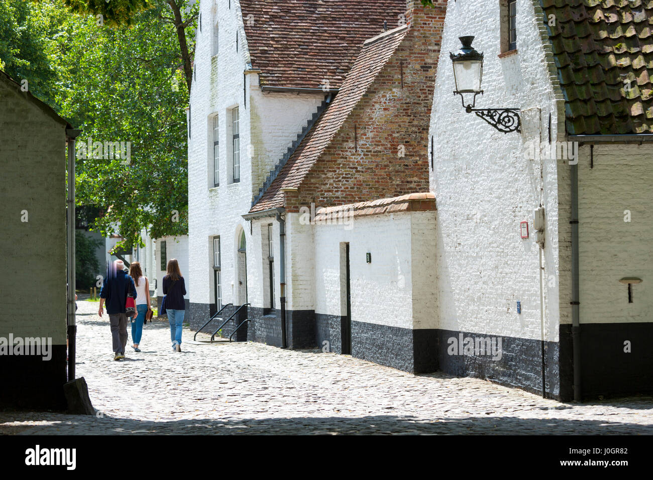Tourists visiting Beguinage convent - Begijnhof Benedictine monastery ...