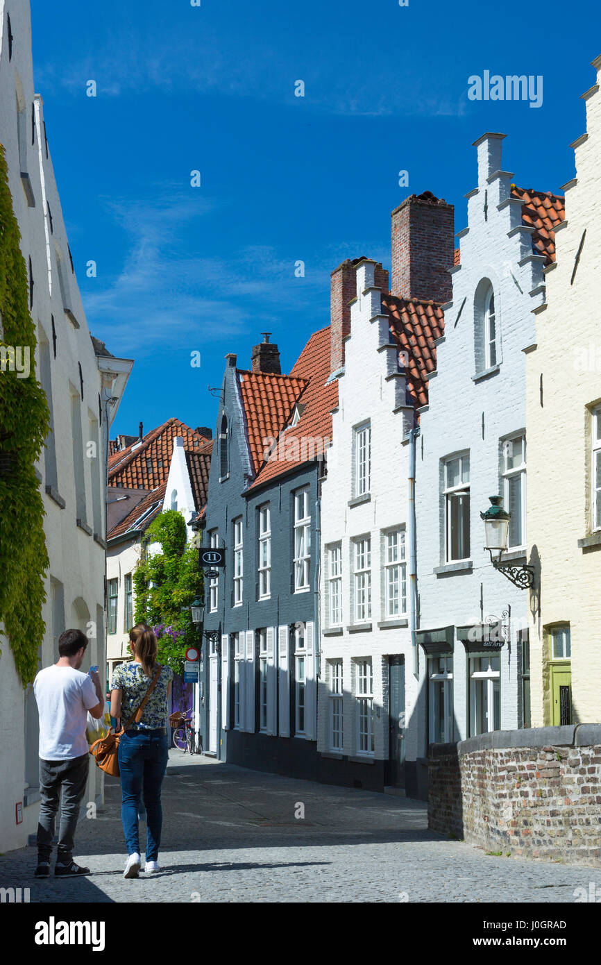 Couple photographing traditional architecture painted houses with crow ...