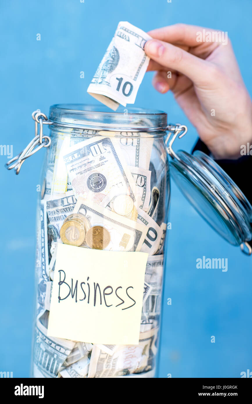 Close up hands putting coins hi-res stock photography and images - Alamy