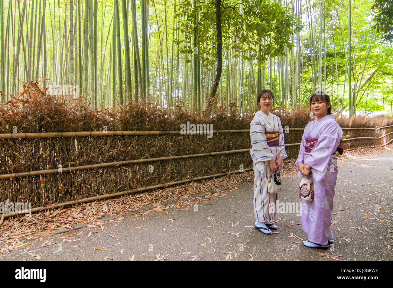 Two Kimono girls at The Arashiyama Bamboo forest in Arashiyama, Kyoto, Japan Stock Photo - Alamy