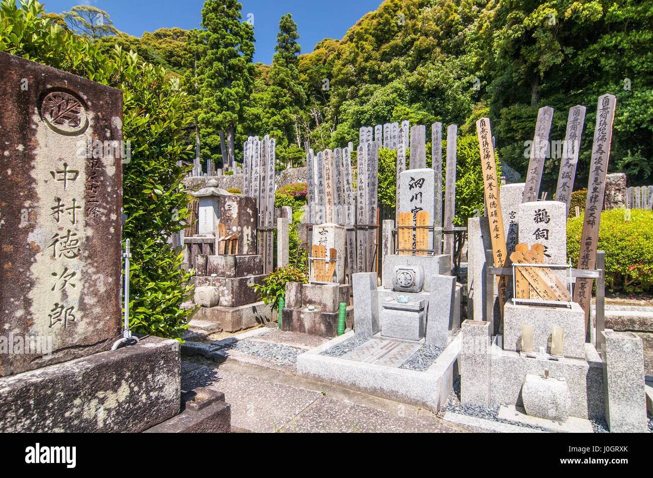 Old graves and headstones of the deceased at a Buddhist cemetery ...