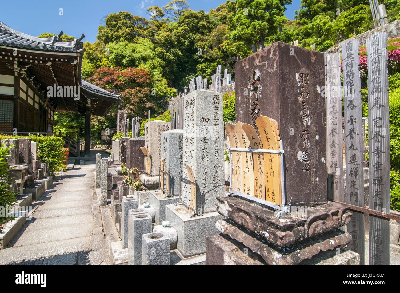 Old graves and headstones of the deceased at a Buddhist cemetery ...