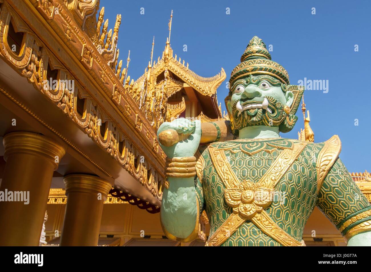 Green buddhist demon guardian statue, Kyauktawgyi pagoda at the foot of ...